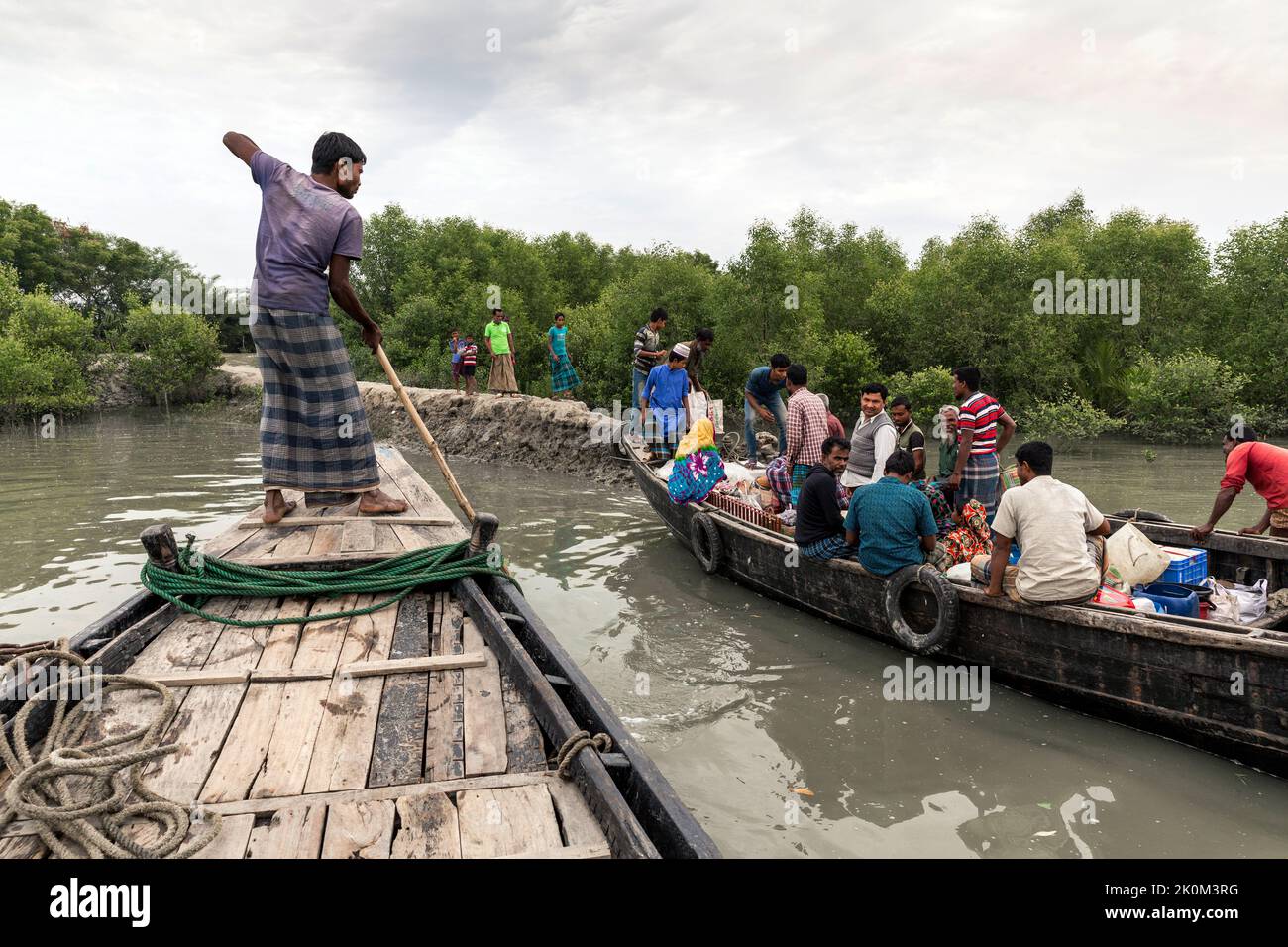 Passenger transport on boats across the river near Shyamnagar. The ...