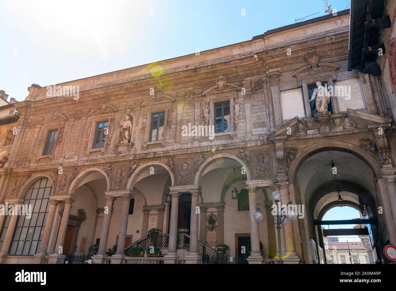 A look of an ancient building with statues and columns in the piazza ...
