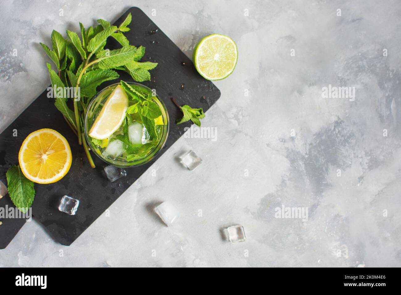 Refreshing summer alcoholic cocktail mojito with ice, fresh mint and ...