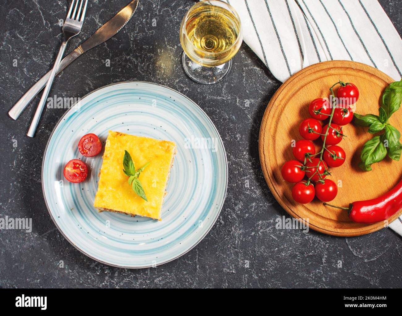 Delicious homemade italian Lasagna with bachamel sauce and glasses of ...