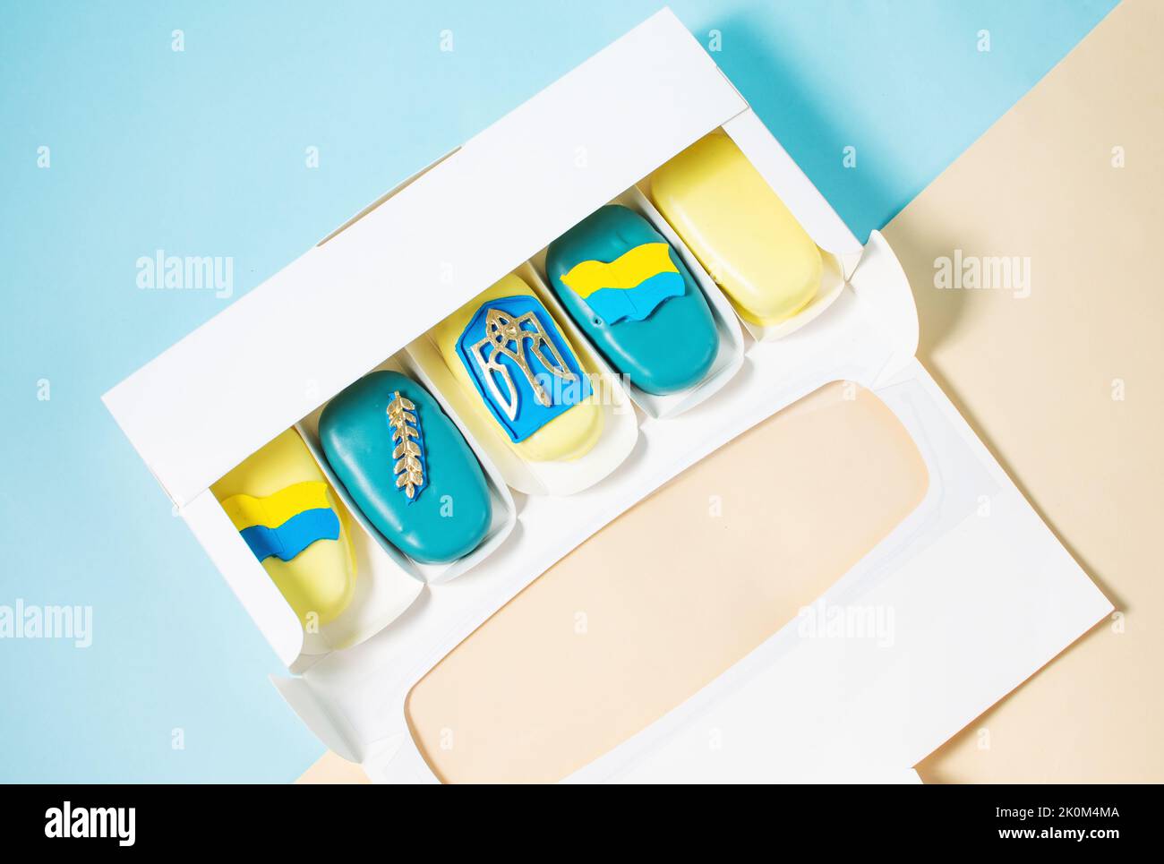 Eskimo cake. Ice cream on stick sweet with blue and yellow chocolate ...