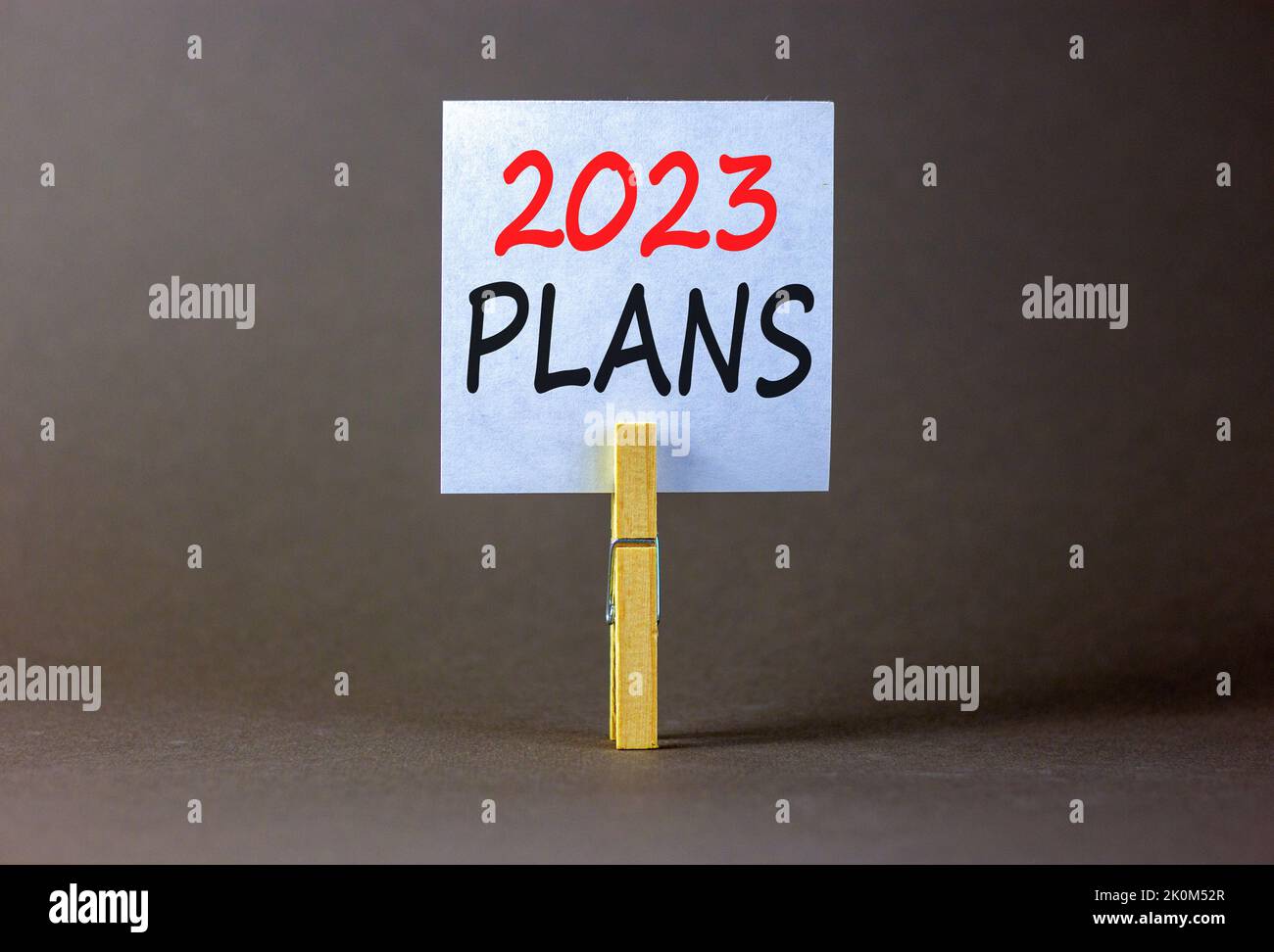 2023 Plans symbol. White paper with words 2023 Plans, clip on wooden ...