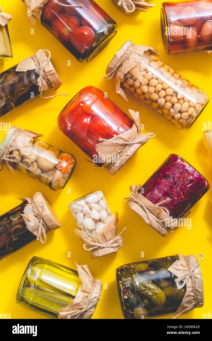 Various kinds preserves vegetables and mushroome in glass jars. Placed ...