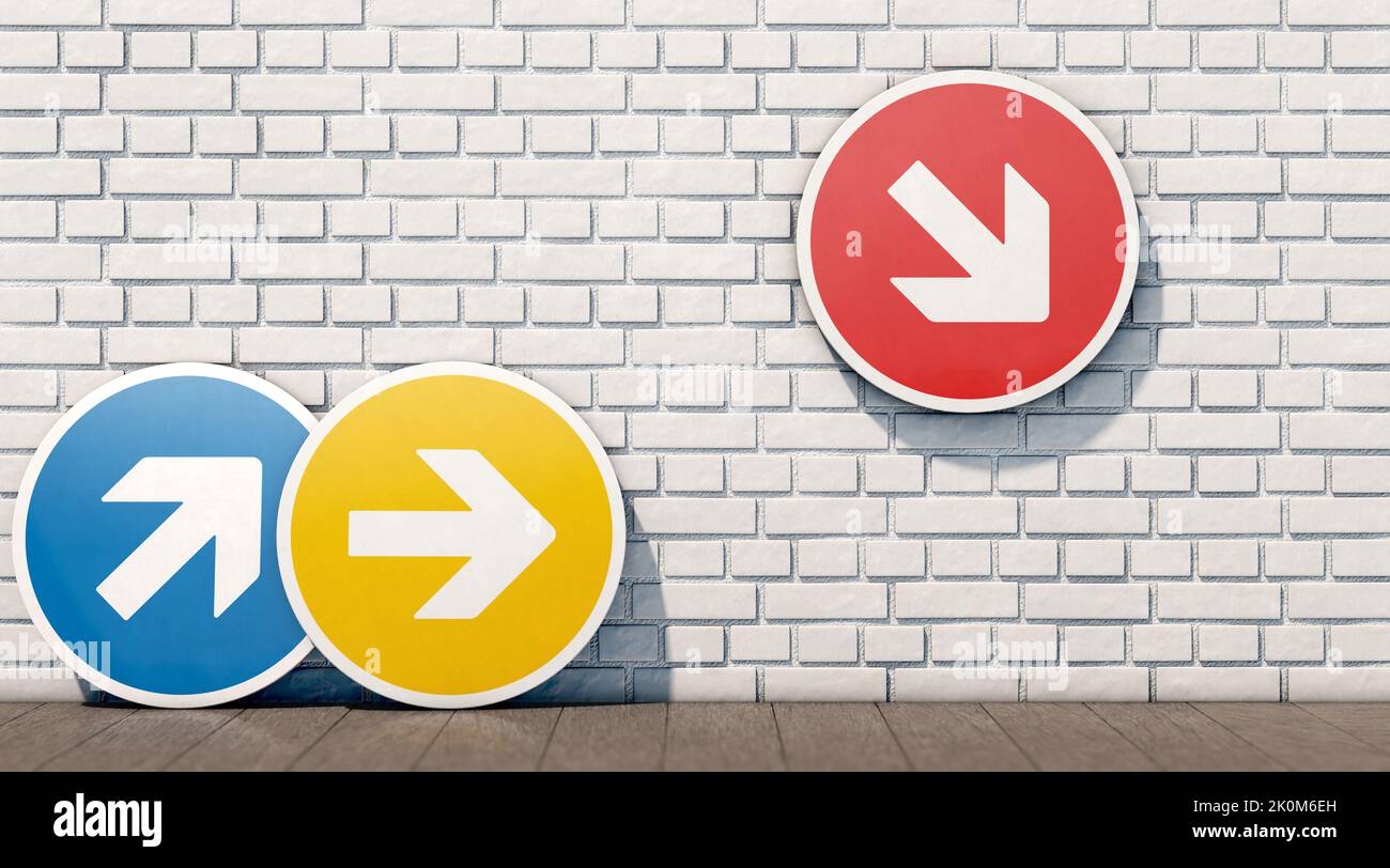 Colored signs on the white brick wall Stock Photo - Alamy