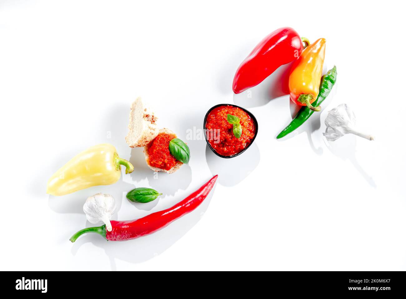 Ajvar with ingredients on white background top view. Ajvar homemade ...