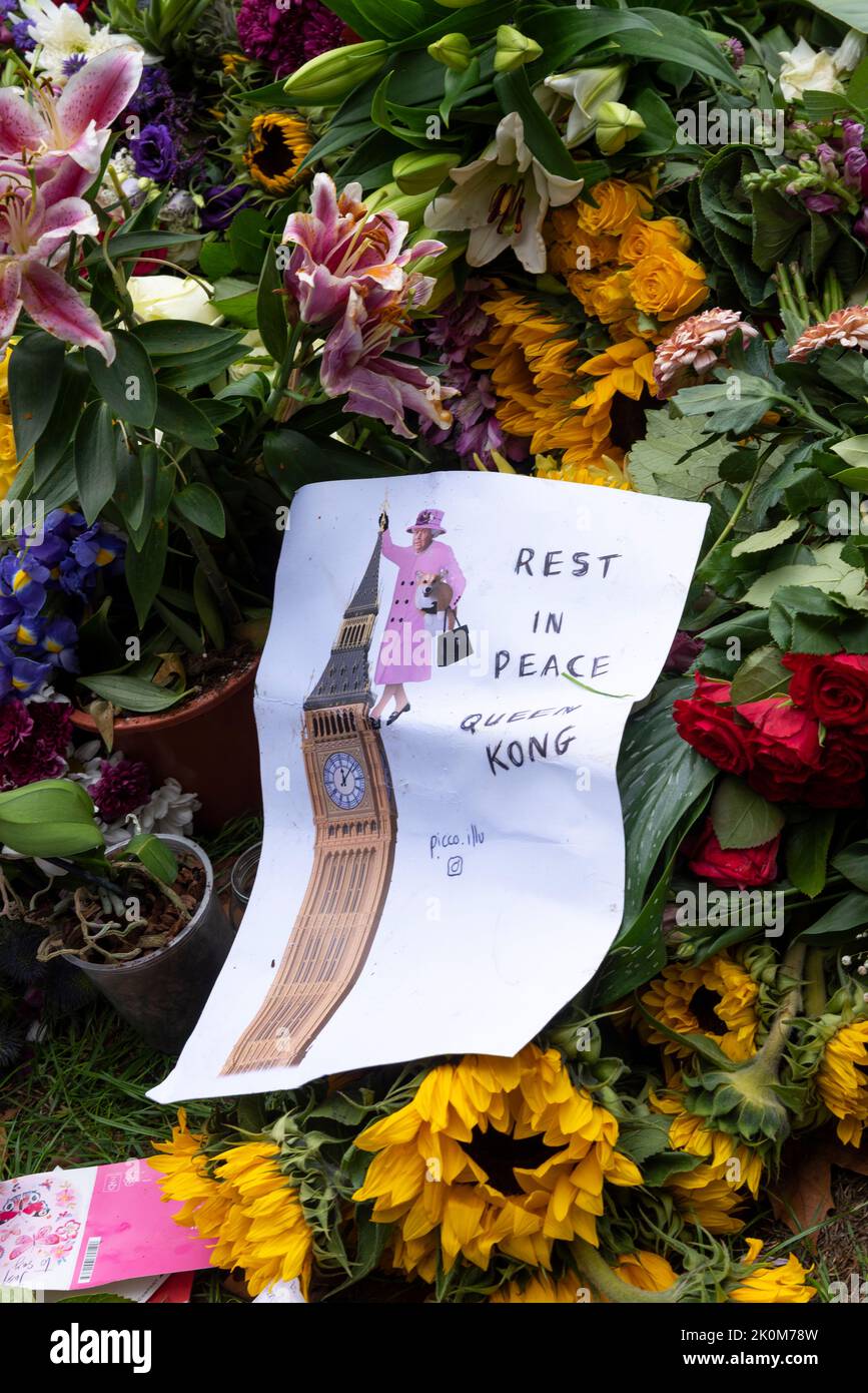 Humorous sign with flowers placed following the death of Queen ...
