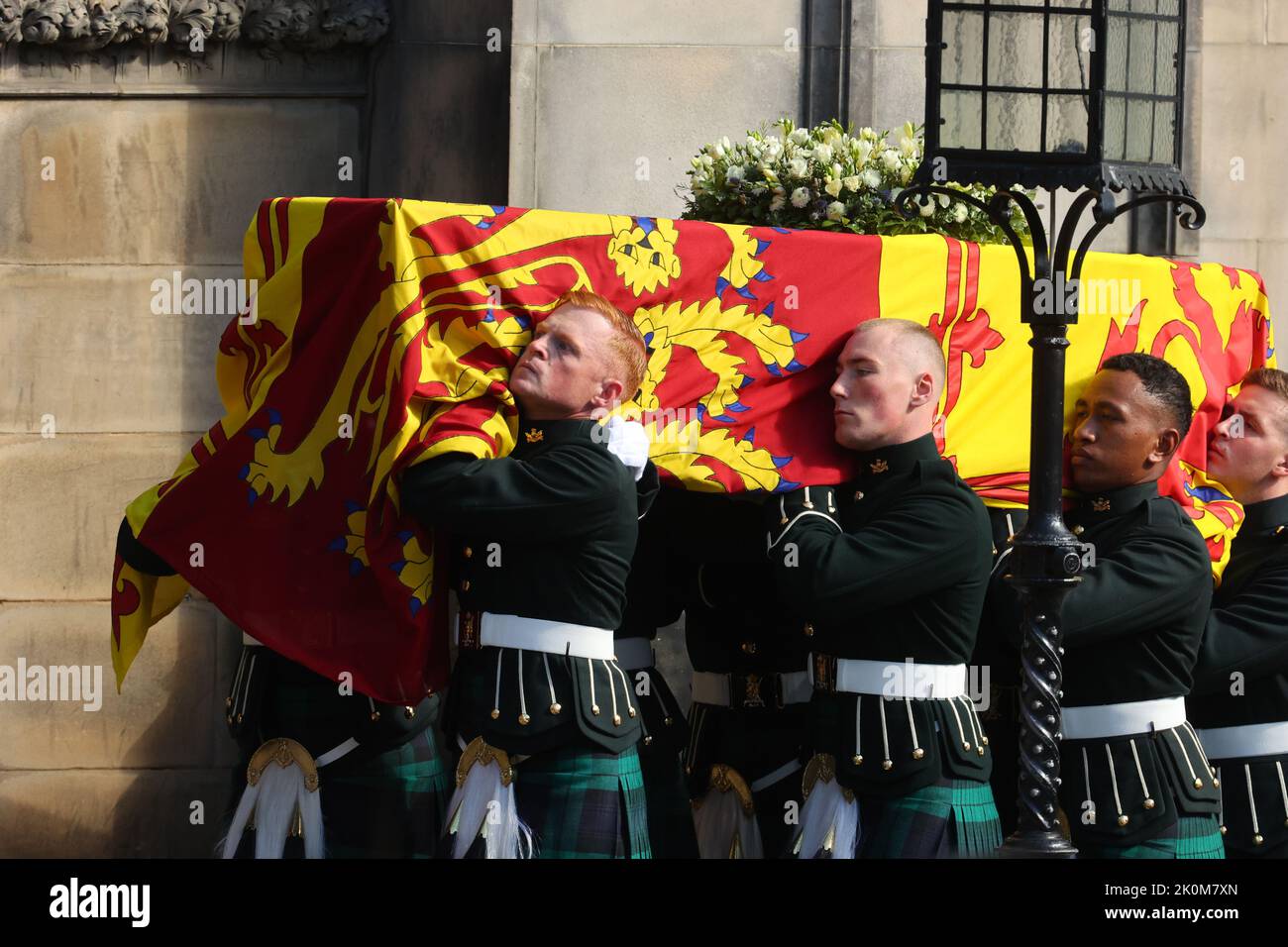 Royal guards carry Queen Elizabeth II's coffin as it arrives at St ...