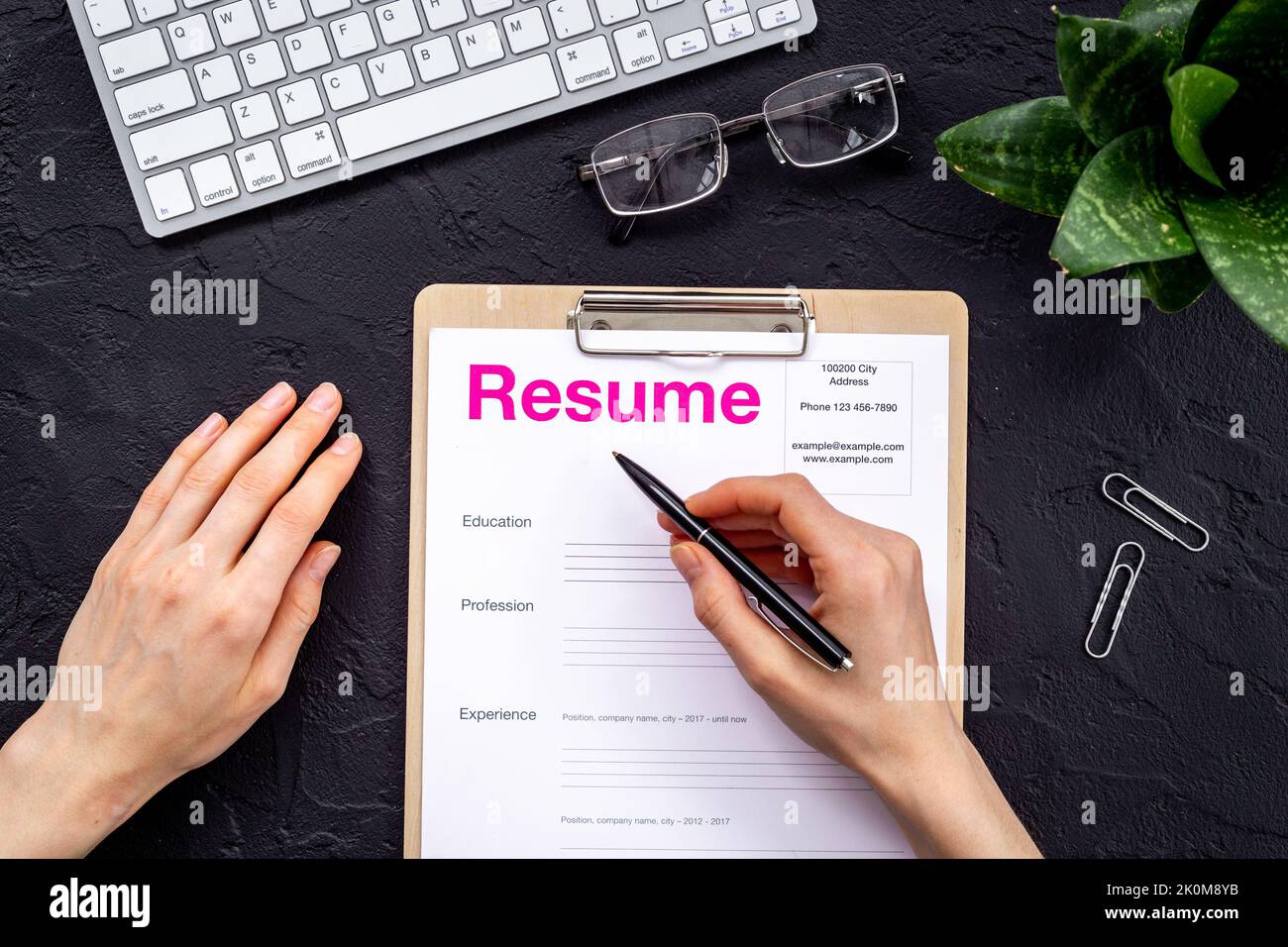 Woman submit resume application hi-res stock photography and images - Alamy