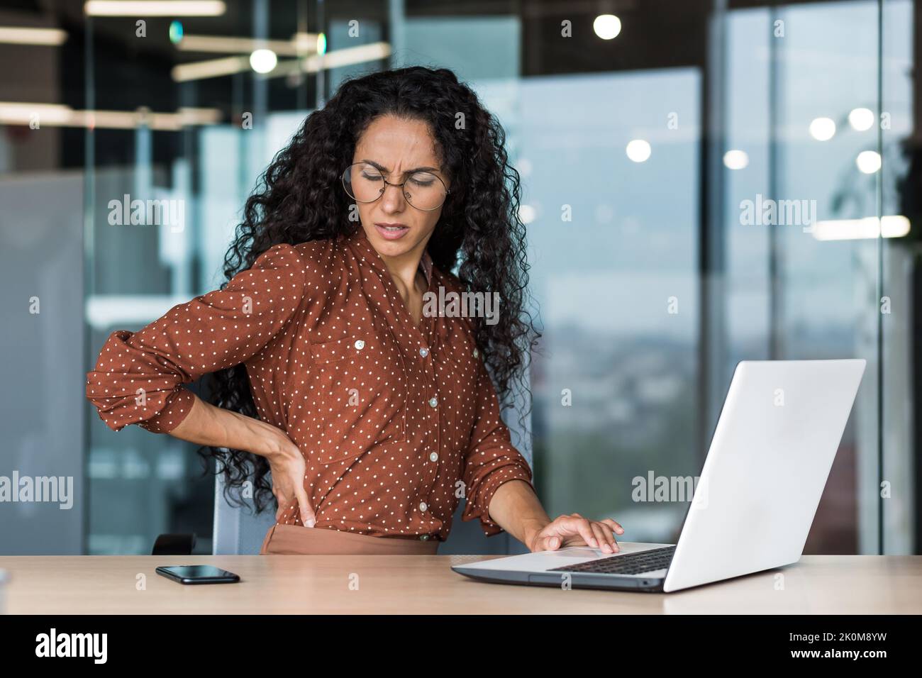 Woman back pain desk hi-res stock photography and images - Alamy