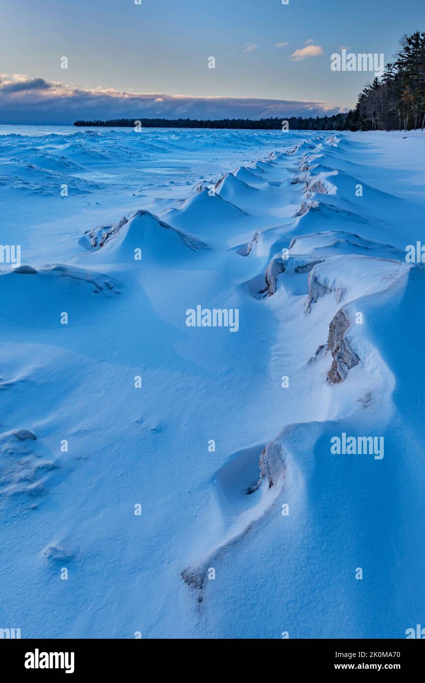 The Europe Bay shore on Lakre Michigan has lines of ice hummocks along ...