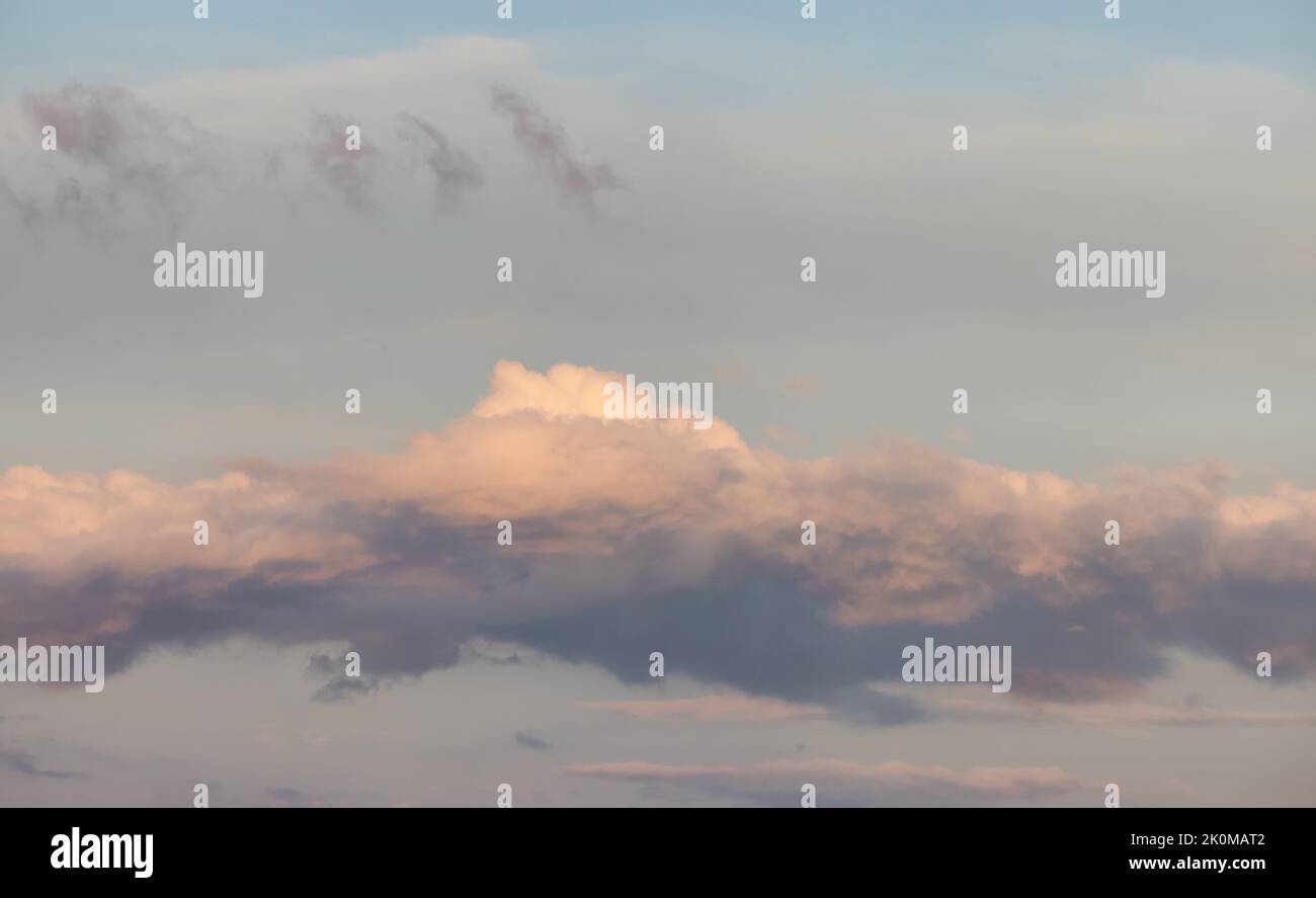 Puff Clouds in the Sky during sunset. Zoom in Stock Photo - Alamy