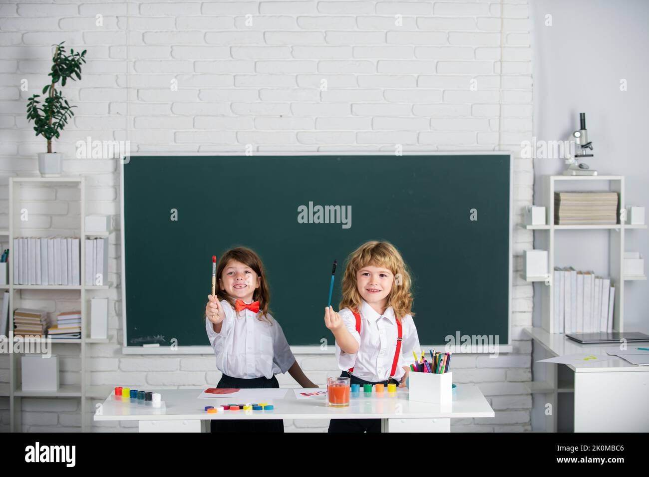 Kids creative education. Funny pupils draws in classroom on school ...