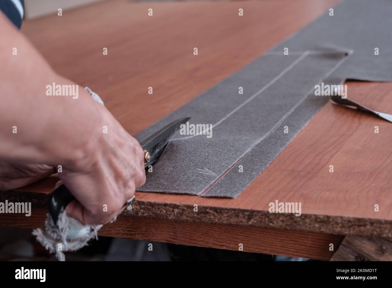 Seamstress cuts fabric scissors hi-res stock photography and images - Alamy