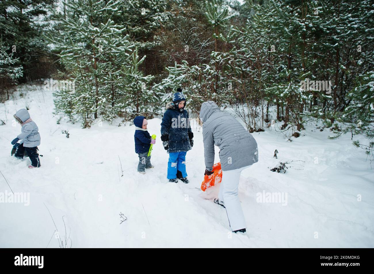 Mother with three children in winter nature. Outdoors in snow Stock ...
