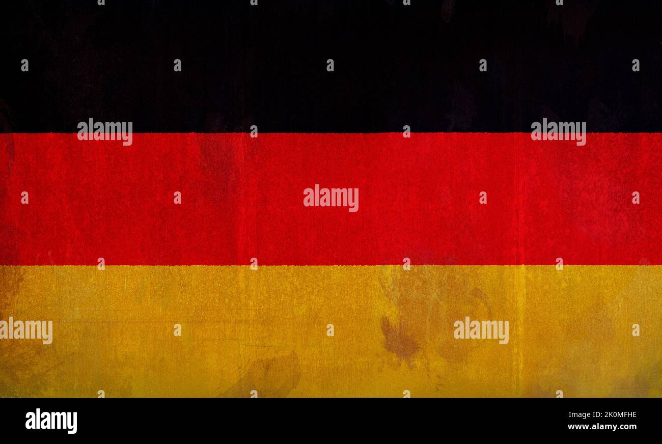 Full frame front view photo of a weathered flag of Germany painted on a ...