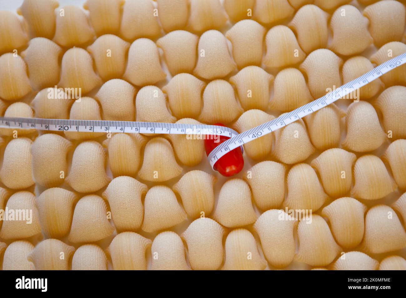 pasta pattern with tape meaure and tomato. Diet plan, menu program ...