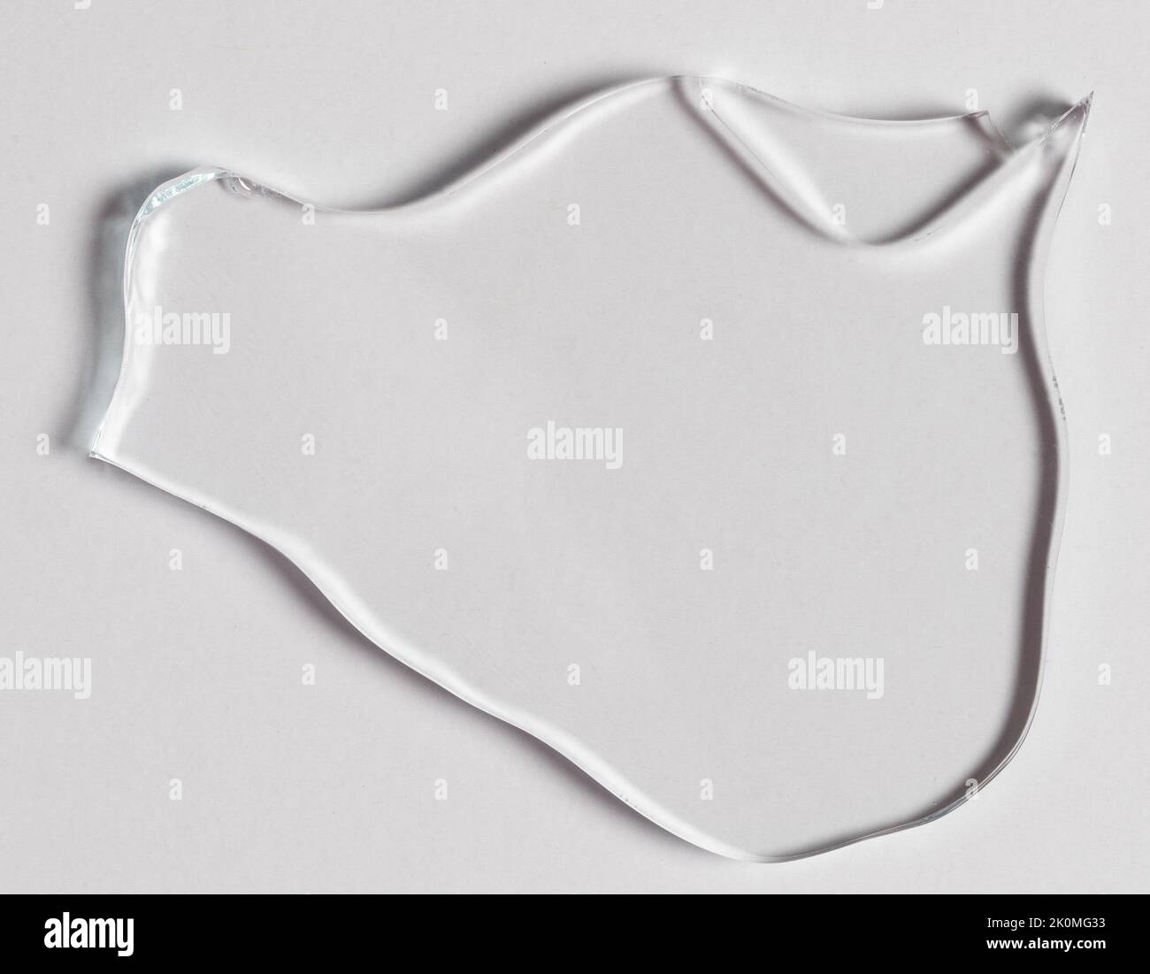 One broken glass fragment piece isolated on white studio background ...