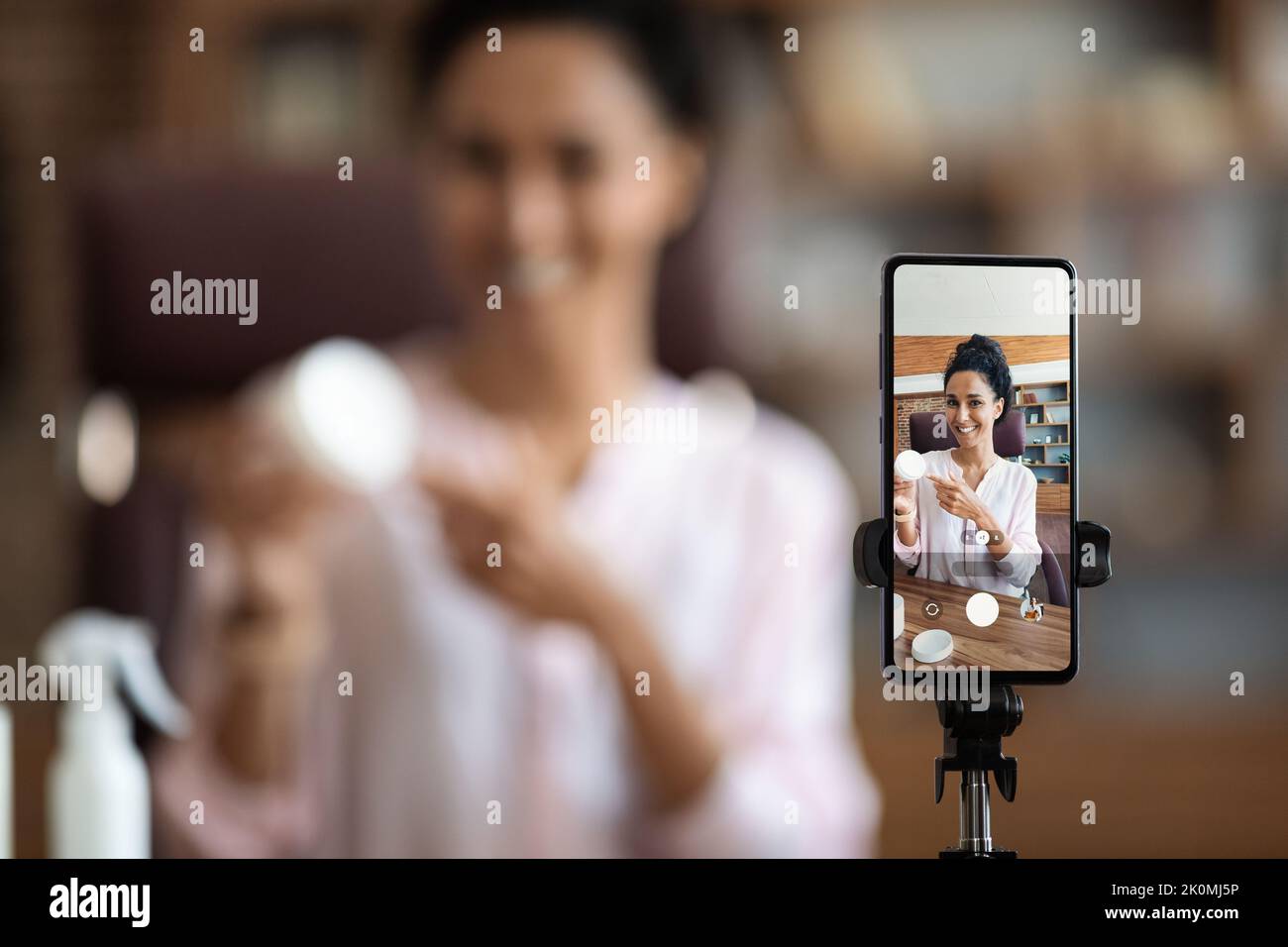 Famous beauty blogger unpacking parcel and streaming from home Stock ...