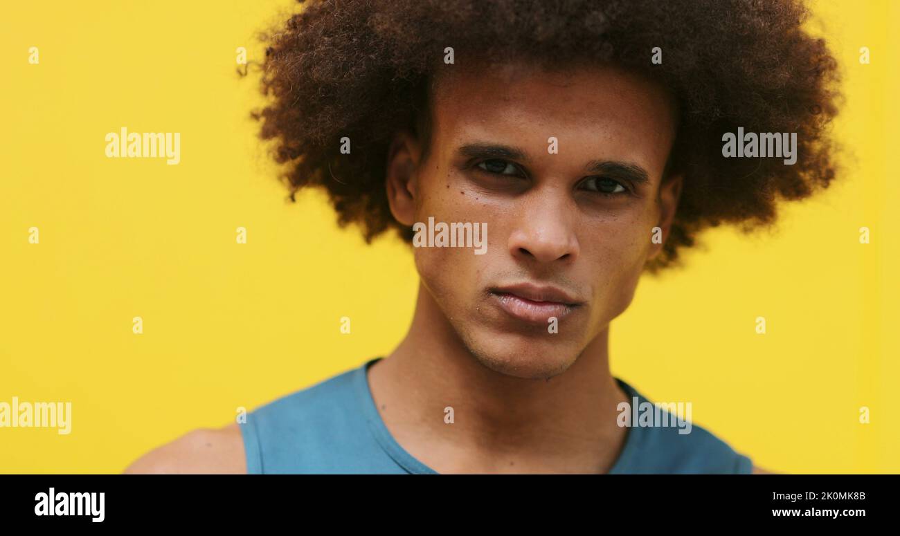 Upset angry young mixed race african american black man with yellow ...