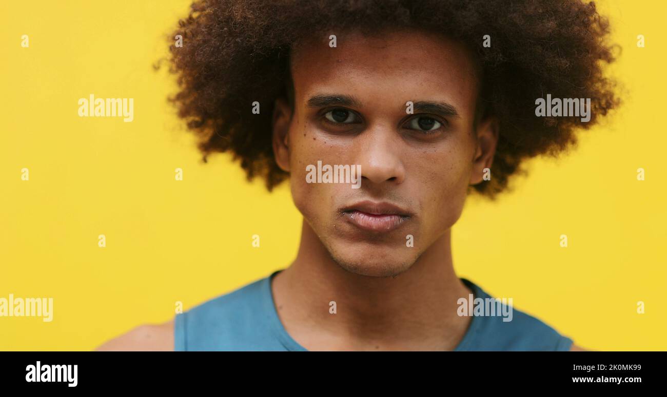 Upset angry young mixed race african american black man with yellow ...