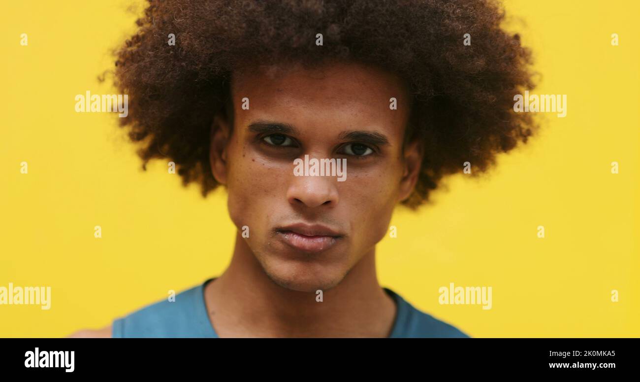 Upset angry young mixed race african american black man with yellow ...