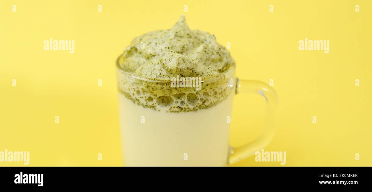 Dalgona Matcha Latte, yellow background. Matcha green tea. Selective ...