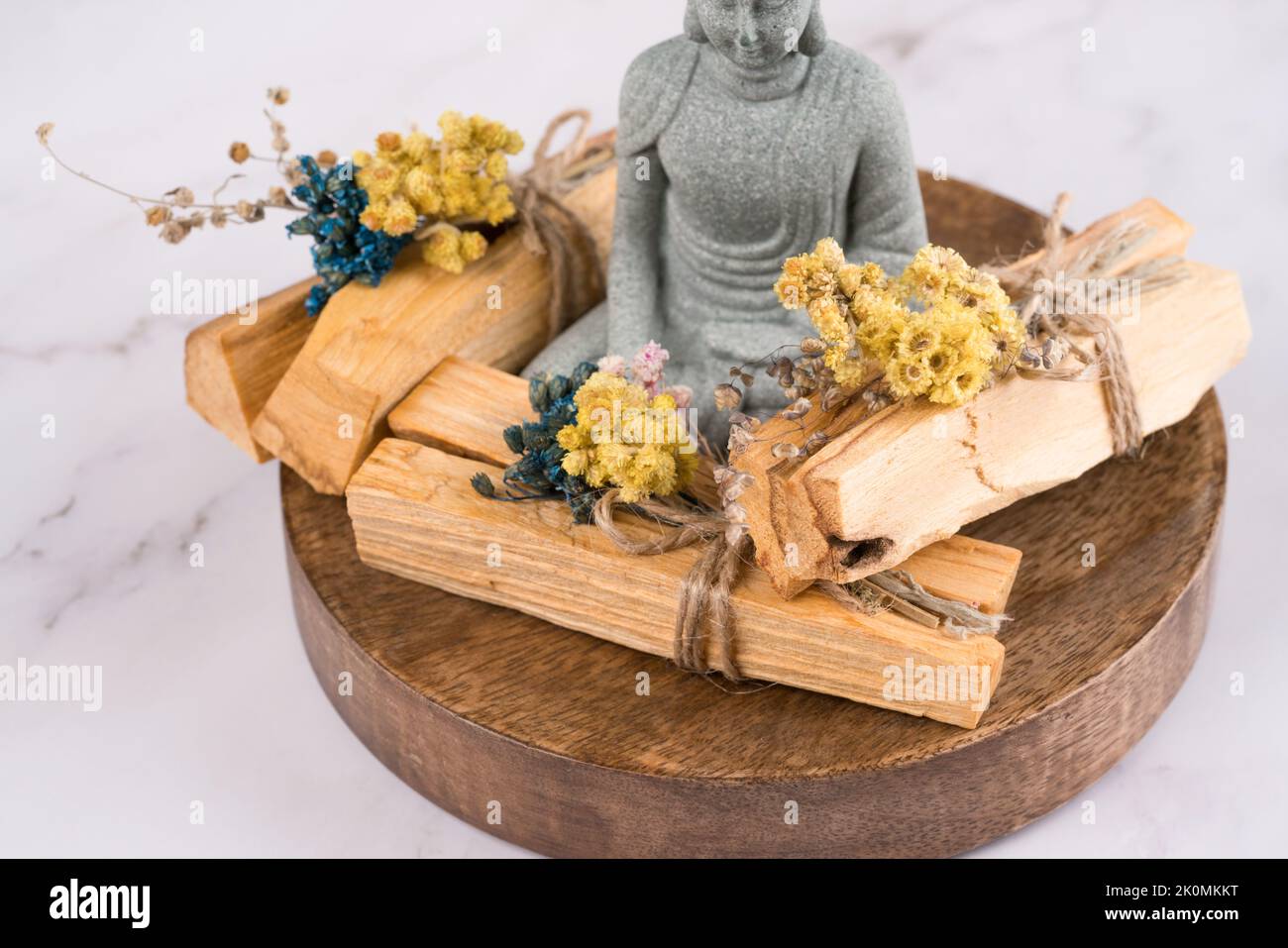 Smudging with palo santo sticks decorated with dry aromatic herbs and ...