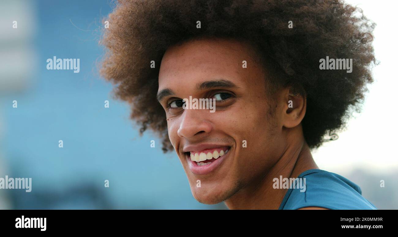 Portrait of handsome young african mixed race man smiling to camera ...