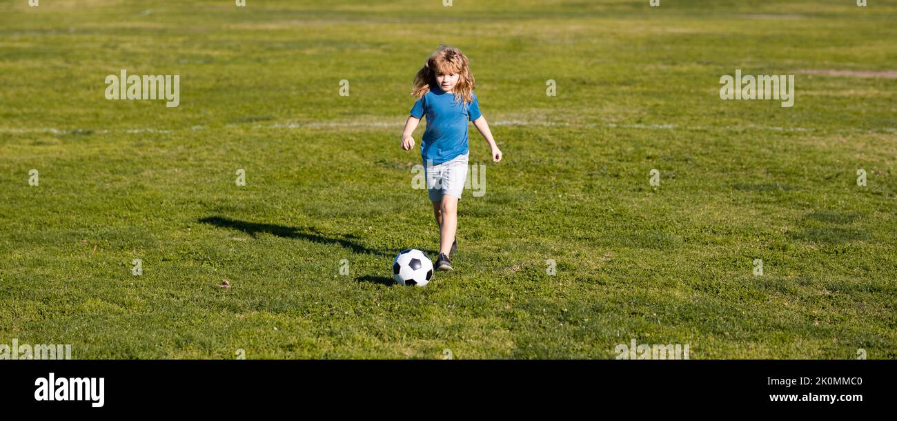 Boy kicking football ball. Soccer kid. Kids play football on summer ...
