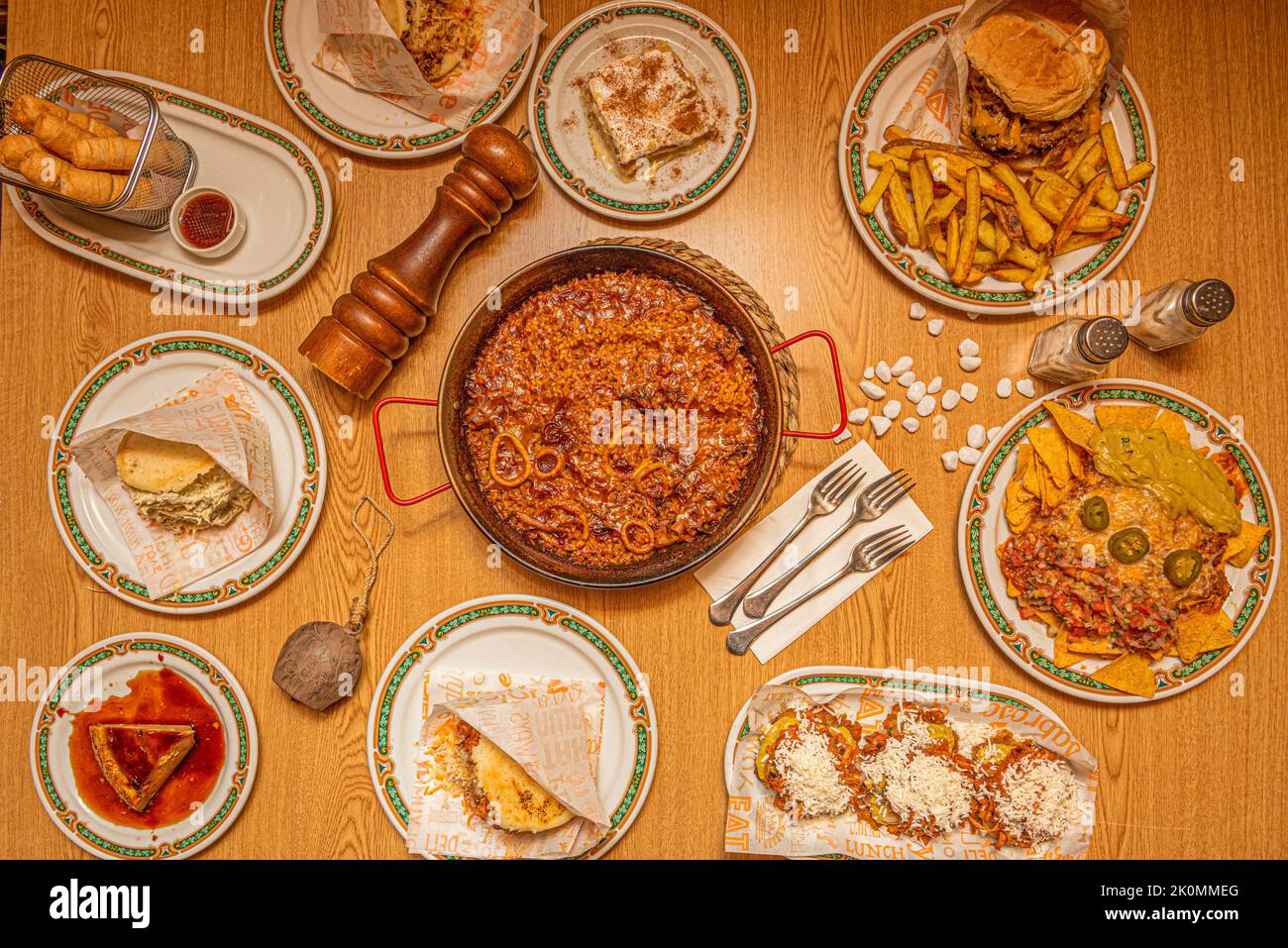 Set of Latin American food dishes and in the center a copy of a Spanish ...