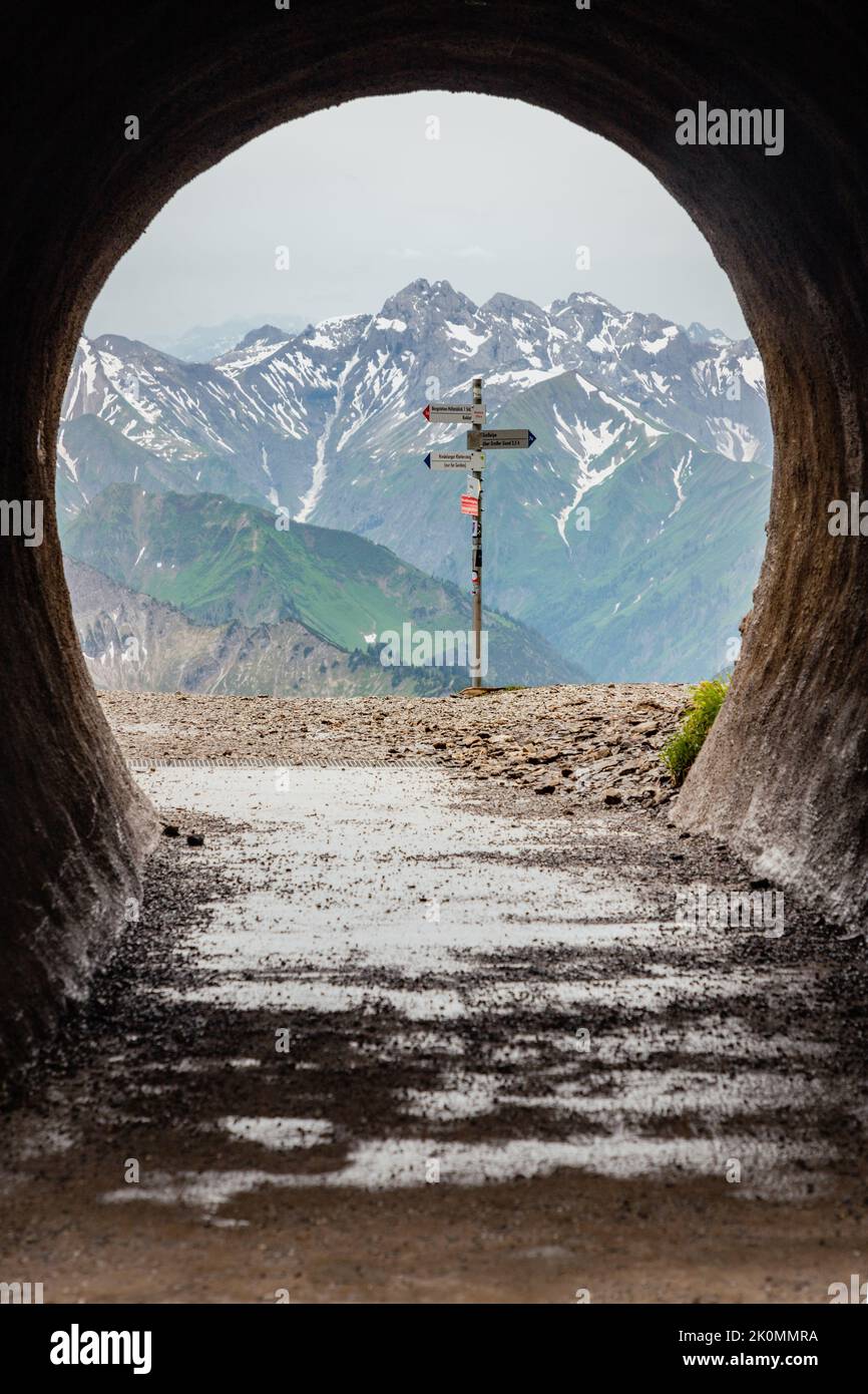 A beautiful view of road signs on the mountain from a tunnel Stock ...