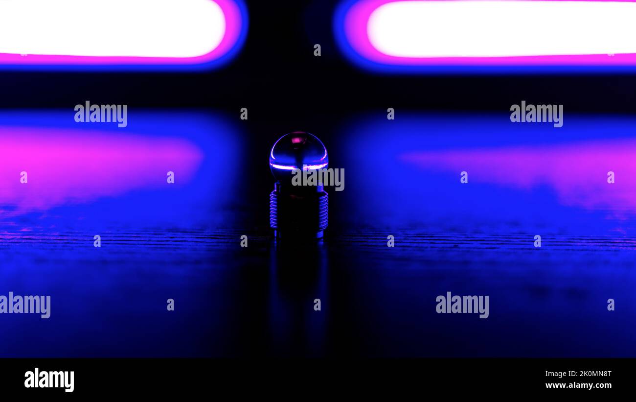 A glass ball on a wooden surface with purple lighting Stock Photo - Alamy