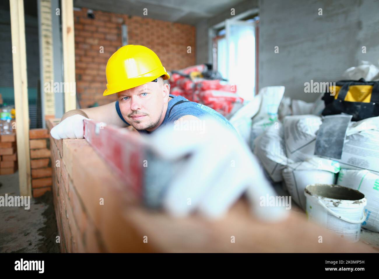 Construction worker carefully laying concrete hi-res stock photography ...