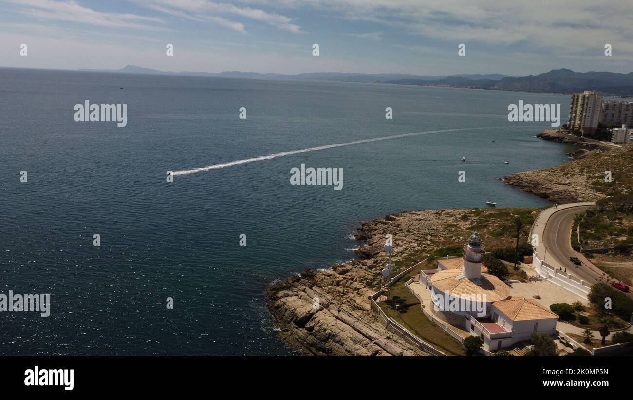 An aerial view of modern buildings of coastal Valencia and speedboa ...
