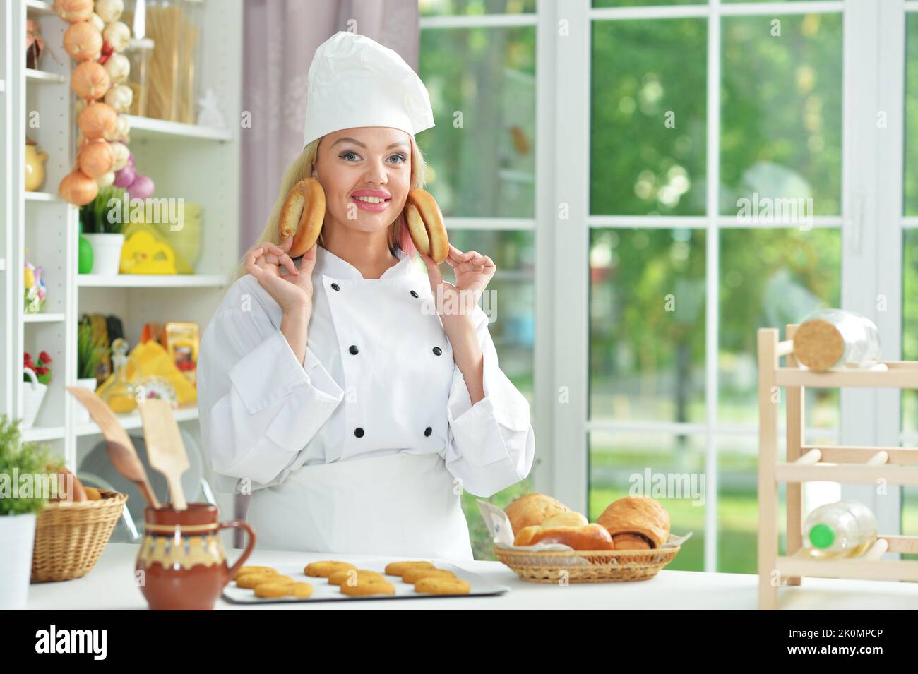 Young woman cooking healthy food in kitchen Stock Photo - Alamy