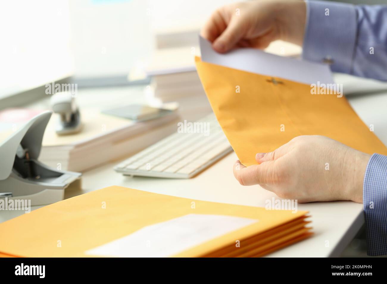 Hand out envelope hi-res stock photography and images - Alamy