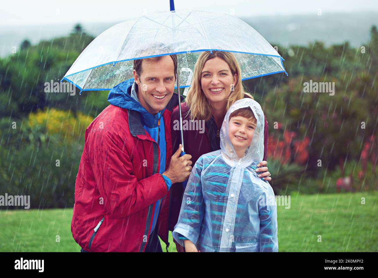 Rain or shine, we love the outdoors. Cropped portrait of a family of ...