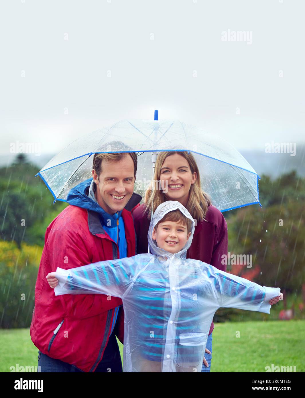 Rain or shine, youll find us outside. Cropped portrait of a family of ...
