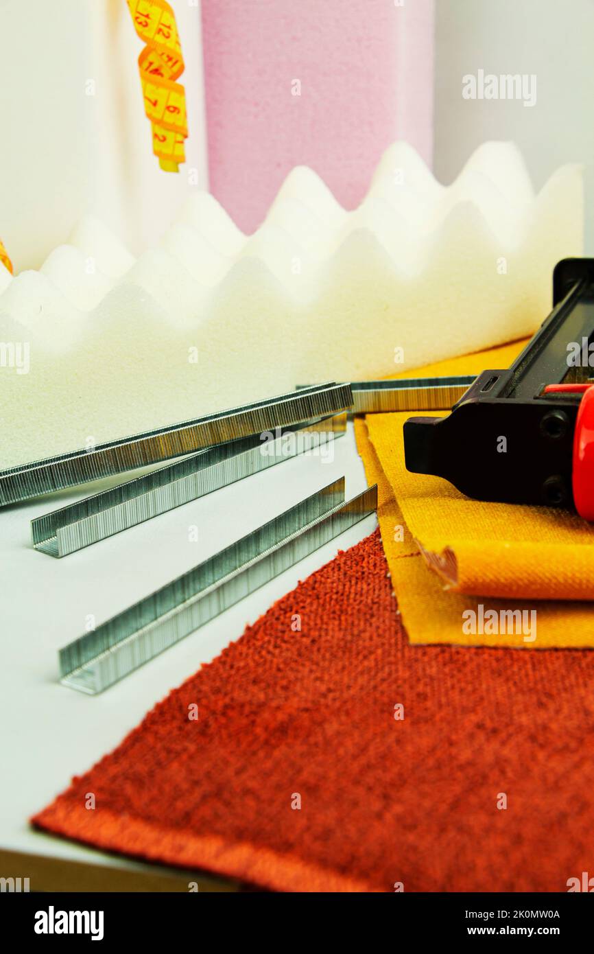 concept of furniture production and repair. Stapler and staples ...