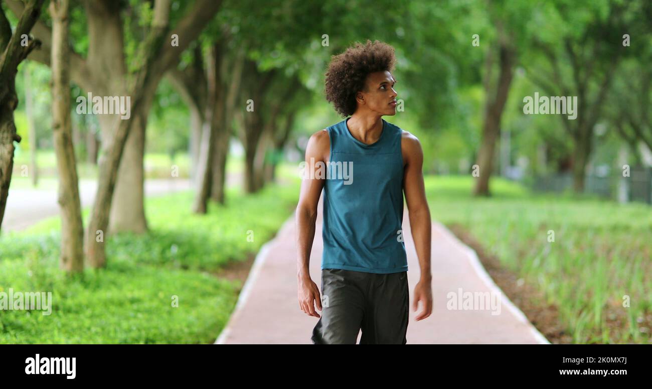 Young black handsome african man walking at park pathway Stock Photo ...