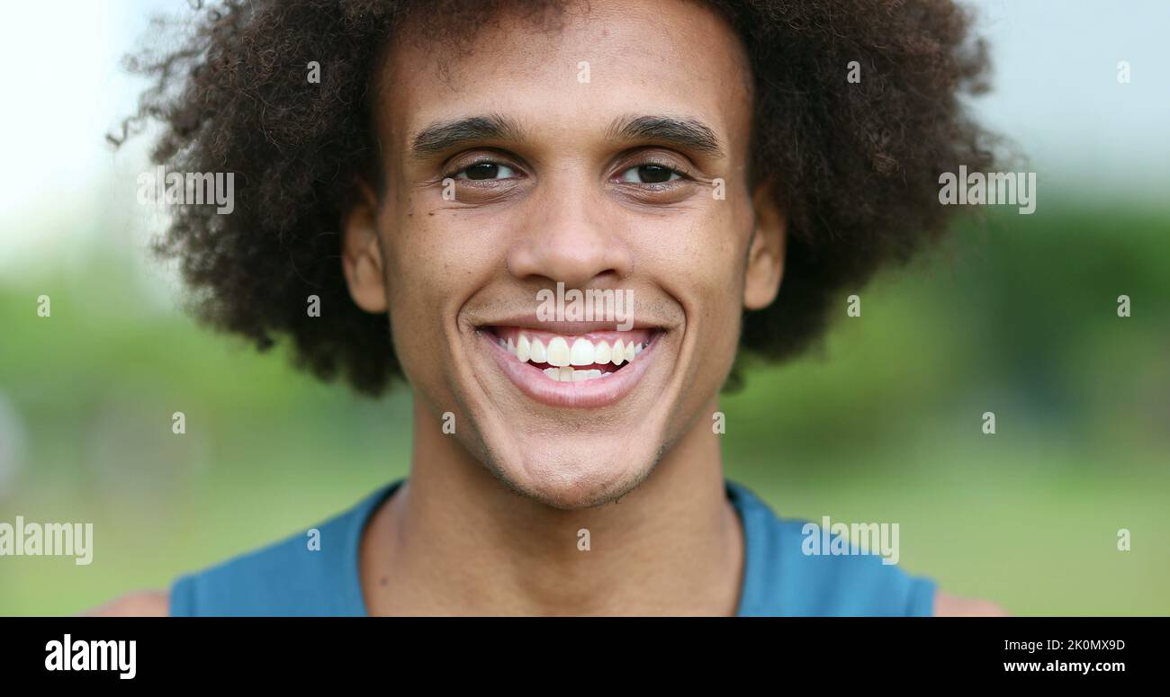 Young handsome mixed ethnicity man closing eyes taking deep breath and ...