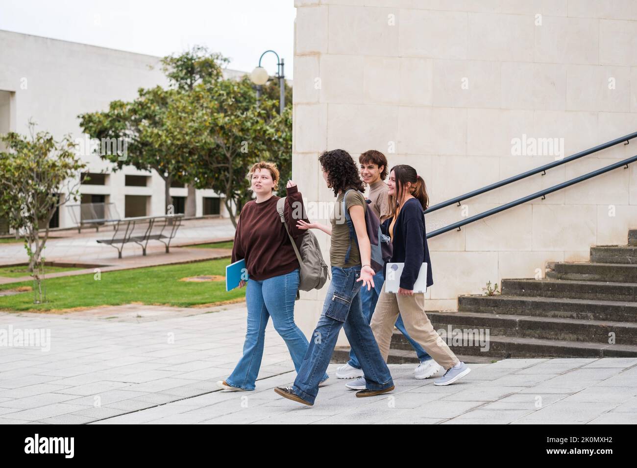 Group of students leaving the library in the university exam season ...