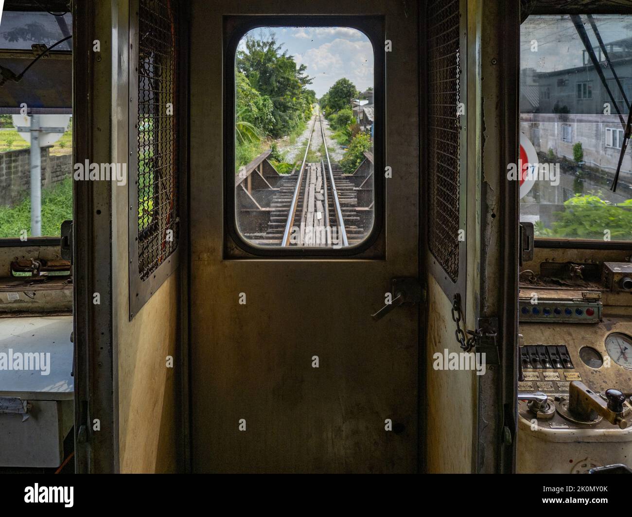 The view of railway tracks from the back door of train in Thailand ...