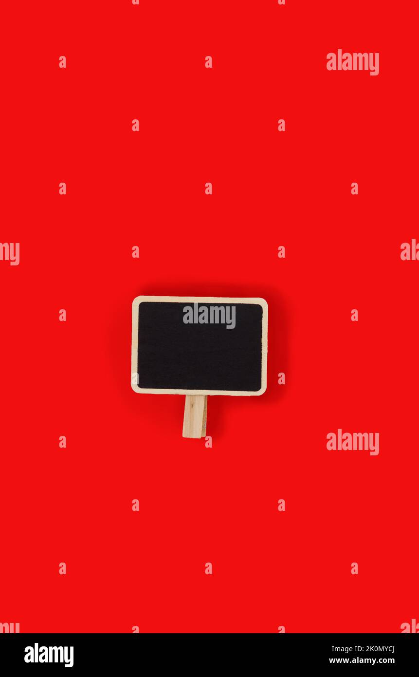Mini blackboard chalkboard with copy space on red background. Template ...