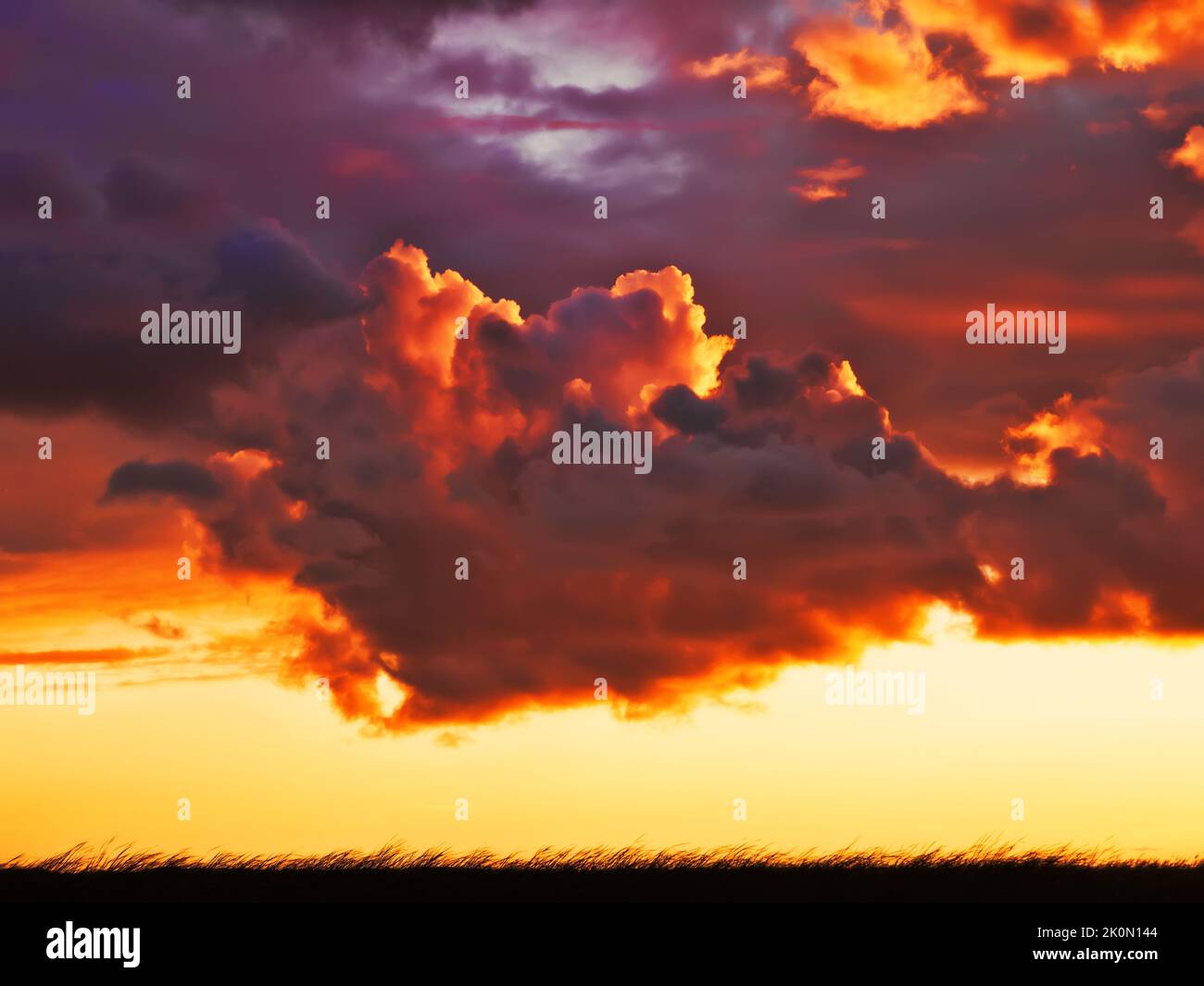 Shift of wind, ragged clouds. Sunset sky colors Stock Photo - Alamy