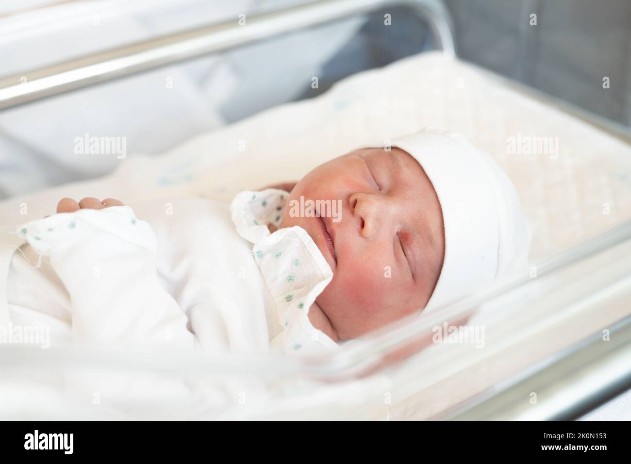 newborn. baby newborn a close-up lies with eyes closed in the hospital ...