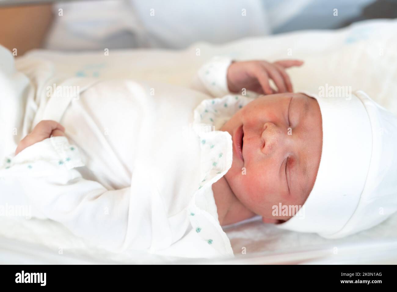 A portrait of sleepy cute newborn baby 2 days after birth Stock Photo ...