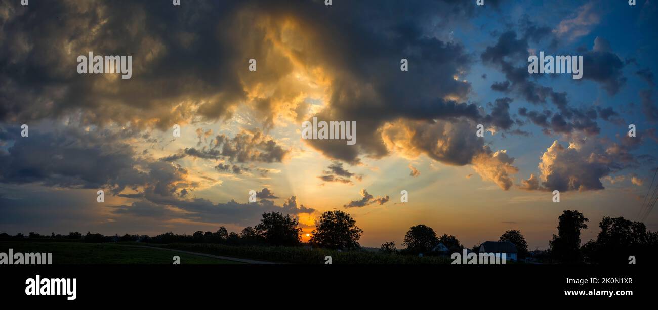 Beautiful sunrise with clouds and rays Stock Photo - Alamy