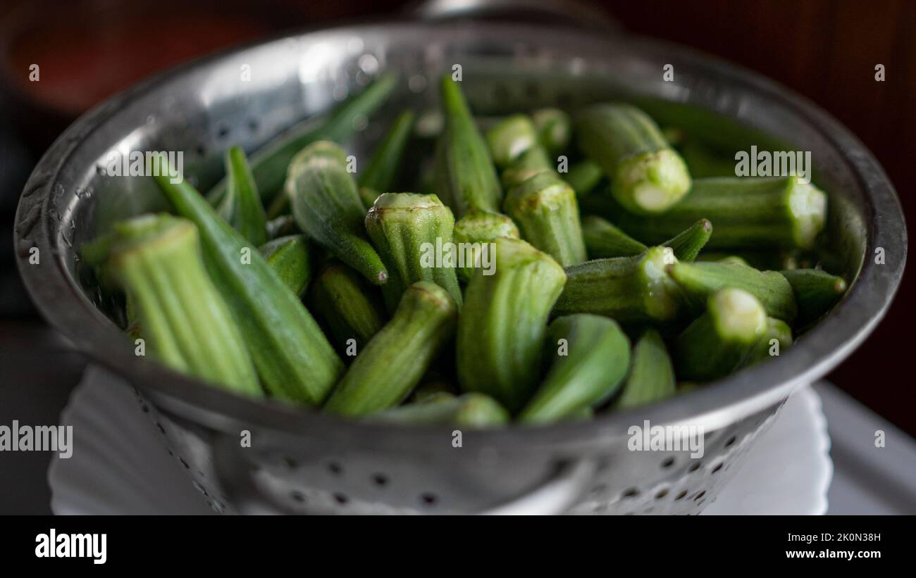 Top view of green fresh okra (known as gumbo or ladies' fingers) ready ...