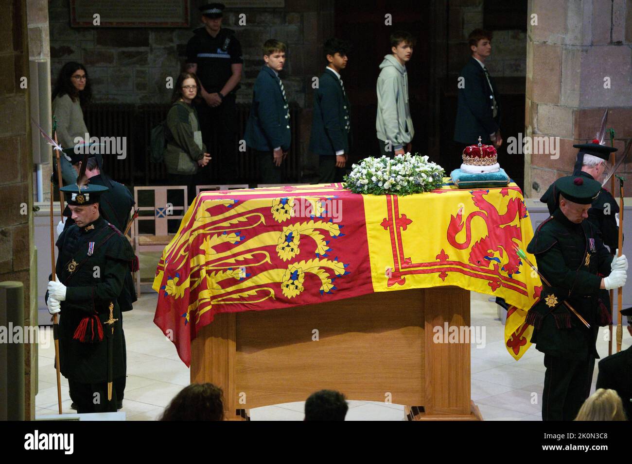 Members of the public file past the coffin of Queen Elizabeth II in St Giles' Cathedral ...